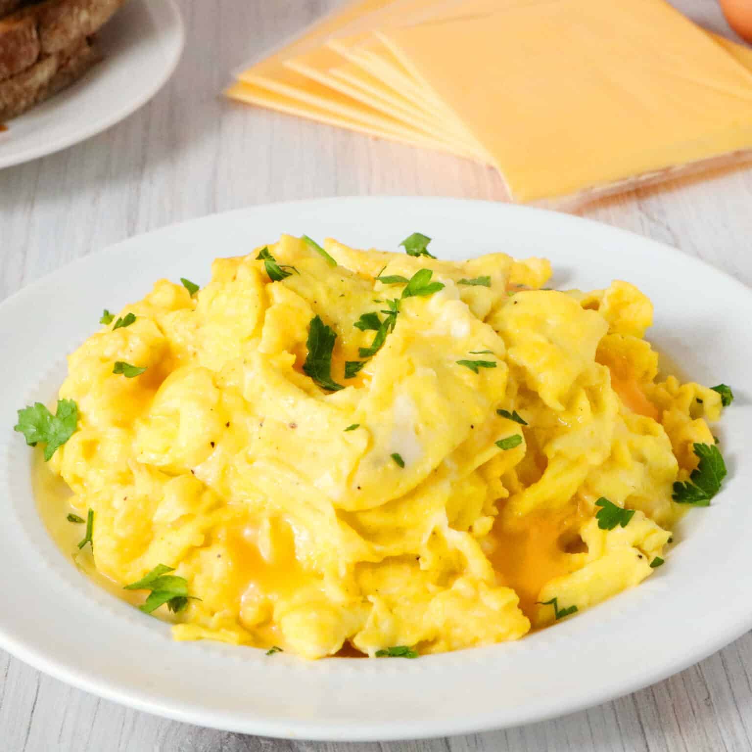 Cheesy Scrambled Eggs (The Fluffiest, Creamiest Eggs Ever!)